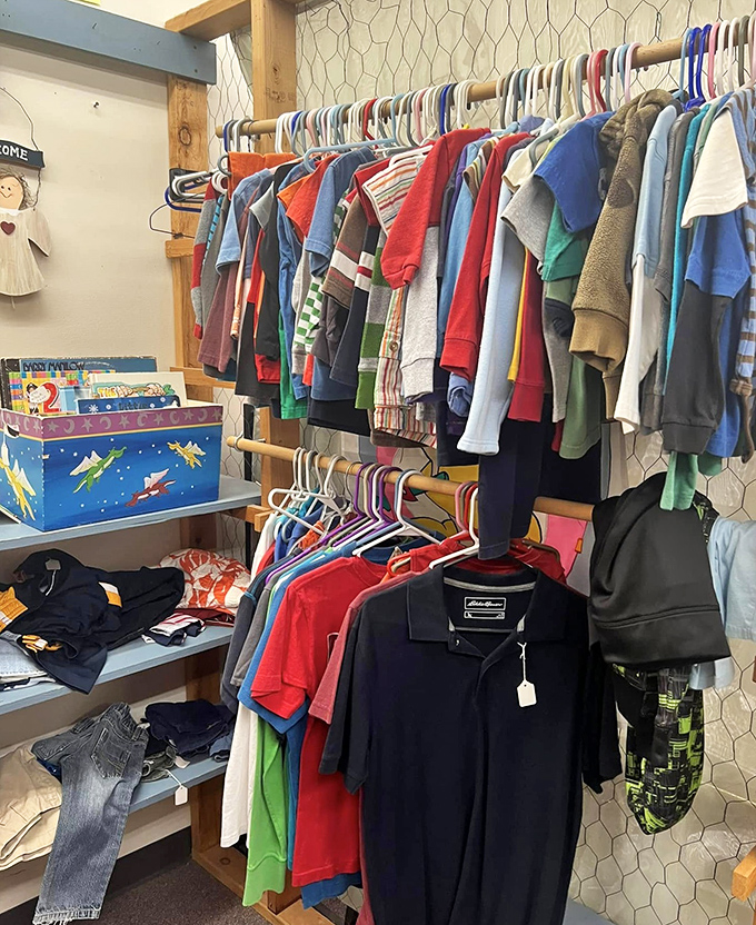 Children's clothing hung with care, proving kids' fashion is cyclical. That rocket-adorned toy chest below probably contains someone's first adventure into space.