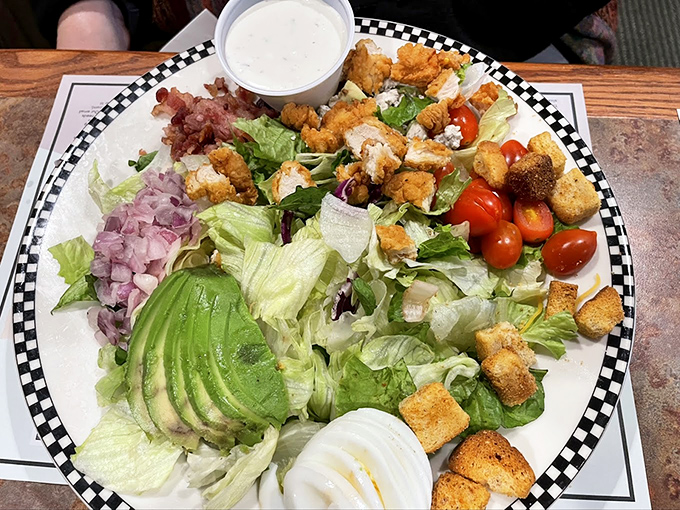 A salad that doesn't apologize for being a salad, with enough toppings to make you forget you're technically eating vegetables.