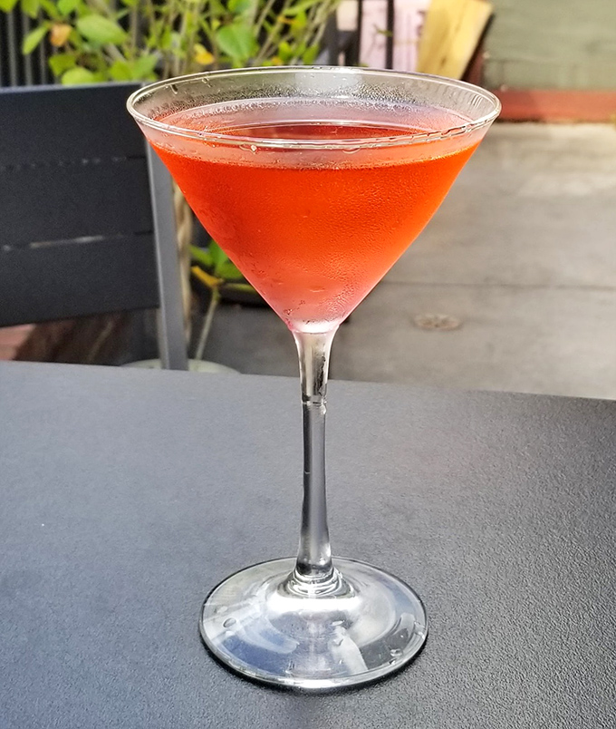A rosy-hued cocktail that looks as sophisticated as it tastes, perfect for sipping while contemplating your excellent life choices.