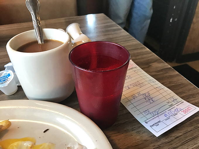 That classic white mug says, "I'm not here to impress you with latte art&mdash;I'm here to caffeinate you properly." The handwritten check is the only receipt you'll need.