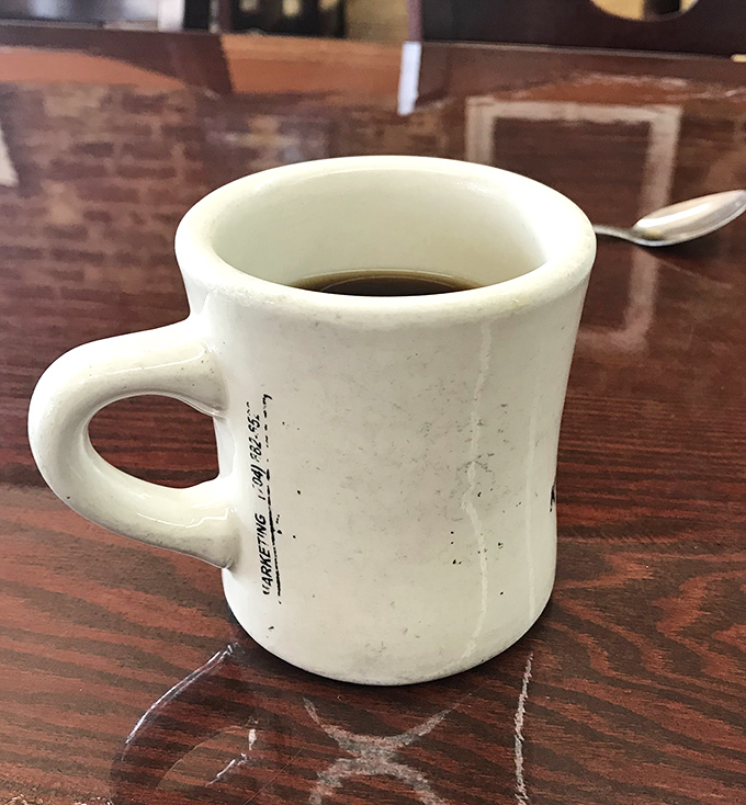 The humble diner mug—battle-scarred veteran of countless refills and early morning conversations. Coffee tastes better with a side of history.