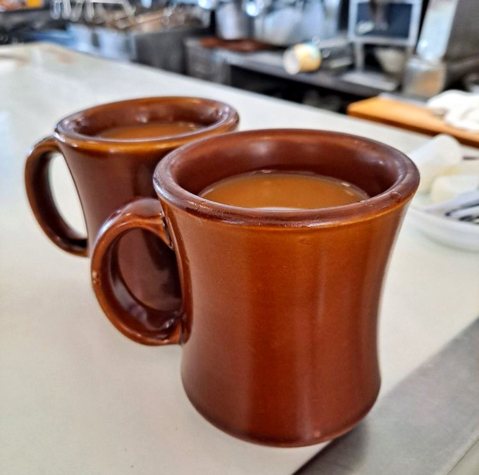Those aren't just coffee mugs&mdash;they're sturdy ceramic vessels of morning salvation, promising infinite refills and zero pretension.