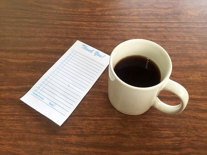 A simple mug of coffee with the check&mdash;the punctuation mark at the end of a satisfying meal. Some traditions need no improvement.