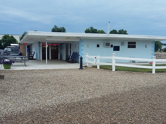 The light blue concession building beckons with promises of classic movie treats and a brief escape from your car's confines.