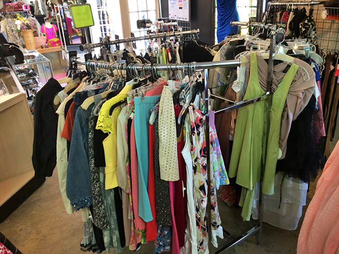 A rainbow of possibilities hanging in perfect formation. Each garment tells a story &ndash; yours could be the next chapter.