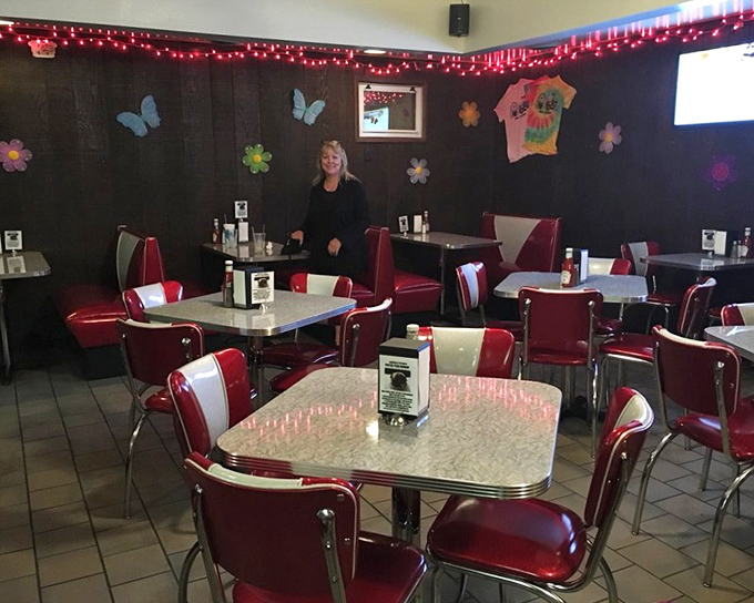 The dining area decorated with seasonal cheer &ndash; where strangers become neighbors and calories temporarily lose their mathematical properties.
