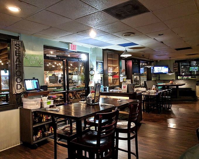 The dining room has that perfect lived-in feel—like your favorite jeans but in restaurant form. Where seafood stories are exchanged across weathered wooden tables.
