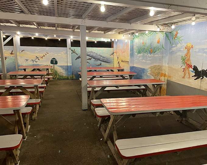 Coastal-themed murals and picnic tables create an unpretentious dining room where the focus stays right where it should be—on the food.