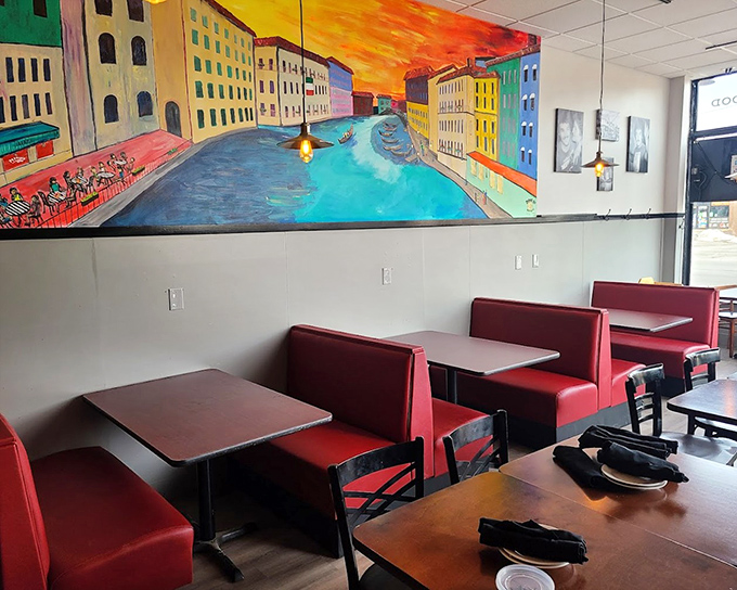 Red booths against vibrant Italian murals create the perfect backdrop for twirling pasta and gesturing wildly during passionate dinner conversations.