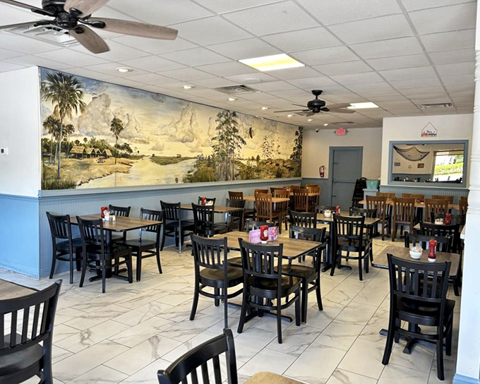The mural of Old Florida waterways watches over diners like a painted promise that seafood this fresh could only come from nearby waters.
