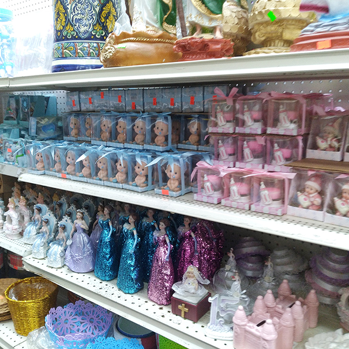 Baby dolls and decorative angels share shelf space in harmonious retail democracy.