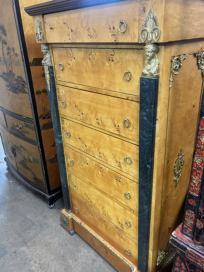 This isn't just furniture&mdash;it's functional art history. That burl wood dresser with brass accents has seen more style changes than Madonna.