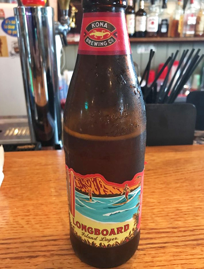 A frosty Kona Longboard lager &ndash; because nothing complements seafood better than a beer that tastes like it was brewed by someone who understands vacation.