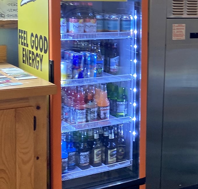 The drink cooler glows like a beacon of refreshment, ready to wash down that slice of pie you're absolutely going to order.