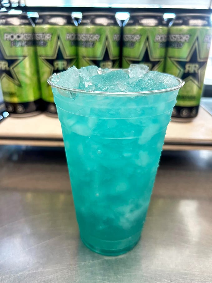 Electric blue refreshment that matches the building! This vibrant drink promises to cool you down while the hot dogs heat things up.