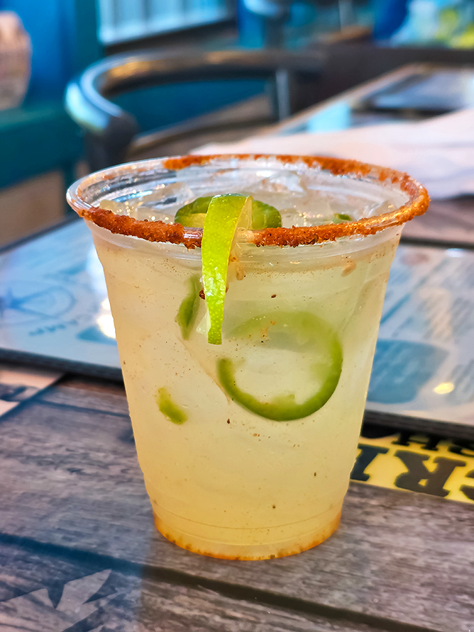 A spice-rimmed margarita with fresh lime &ndash; because nothing complements seafood quite like tequila with a salty attitude and citrus charm.