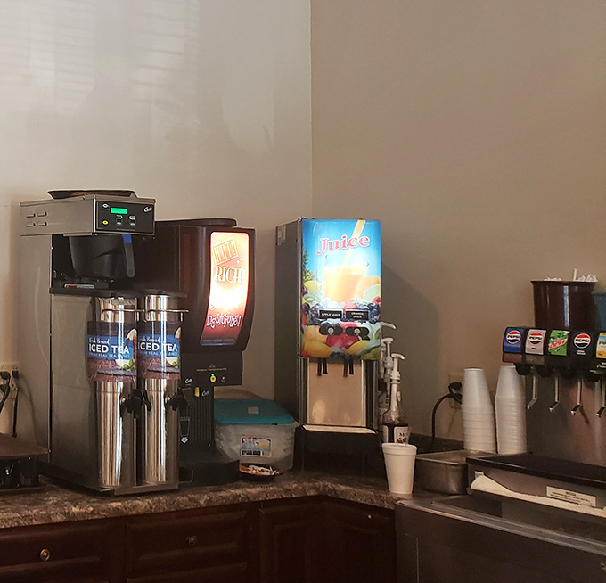 The beverage station&mdash;where decisions between coffee, juice, or soda become philosophical questions at 7 AM.