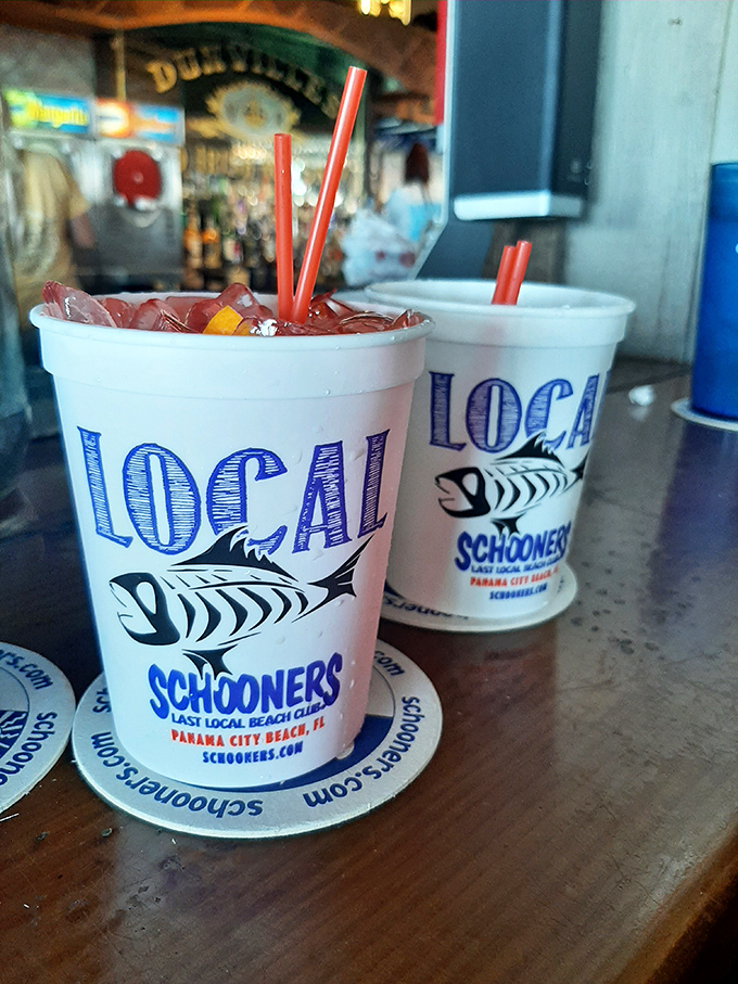 These aren't just drinks; they're liquid postcards from paradise. The "LOCAL" cups are truth in advertising &ndash; nothing tastes more local than sipping these on Schooners' deck.