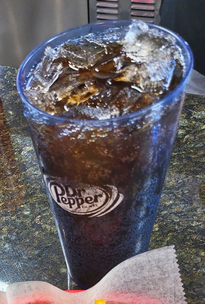 That frosty Dr. Pepper isn't just a drink&mdash;it's the perfect palate companion for your burger adventure, served in a glass that sweats with anticipation.