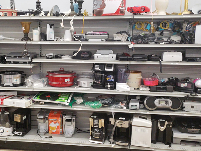 The small appliance graveyard, where coffee makers and bread machines await resurrection. Yesterday's must-have gadgets hope for a second chance at kitchen glory.