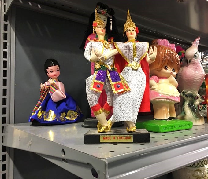 Where else can you find Thai dancers, vintage dolls, and kitschy figurines having what looks like the world's most eclectic dinner party? Thrift store magic at its finest!