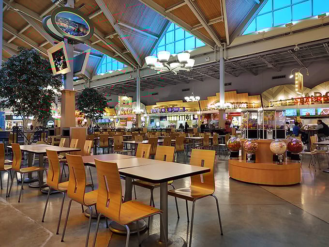 The food court: civilization's greatest achievement, where culinary diplomacy means Thai food, pizza, and soft pretzels can peacefully coexist under one soaring ceiling.