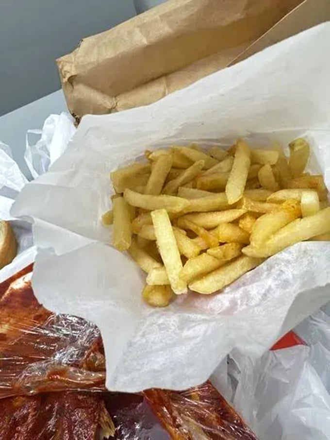 French fries so perfectly golden they deserve their own trophy, ready to perform their sacred duty as sauce-delivery vehicles.