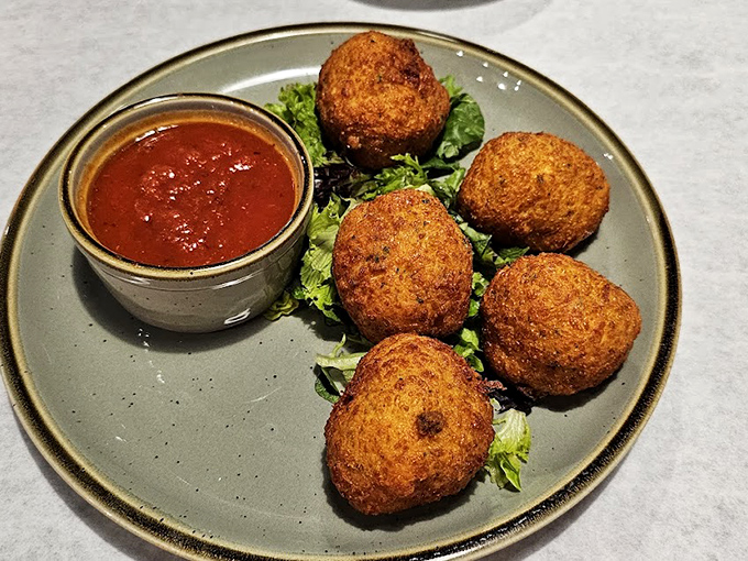 Golden-fried fritters that crunch like nature's perfect percussion instrument. The sauce isn't optional&mdash;it's the exclamation point on deliciousness.