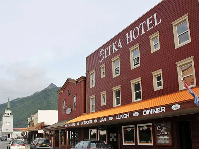 The historic Sitka Hotel wears its heritage proudly, a crimson landmark where travelers have rested their heads since Alaska was America's newest purchase.