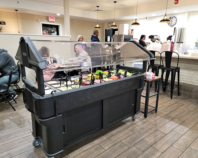 The salad bar stands ready for those who want to pretend they're eating healthy before diving into dessert. Self-deception never tasted so crisp and fresh.