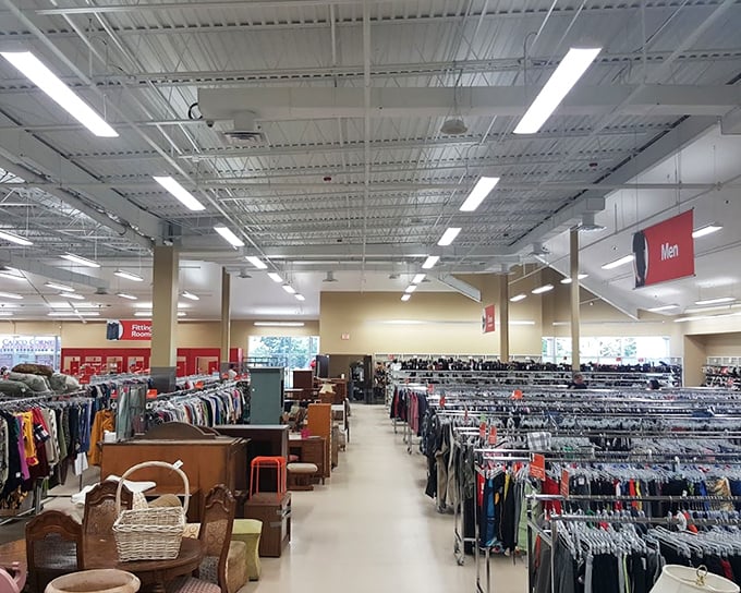 The men's department stretches into the distance like a sea of potential style upgrades. That chair in the foreground? Someone's husband's waiting spot.