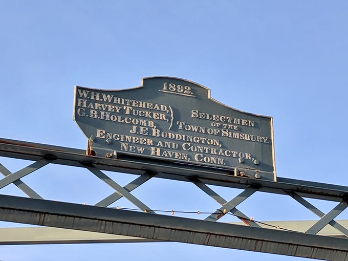 History hangs overhead, with this plaque telling tales of 1892 when bridges were built to last &ndash; and eventually bloom.