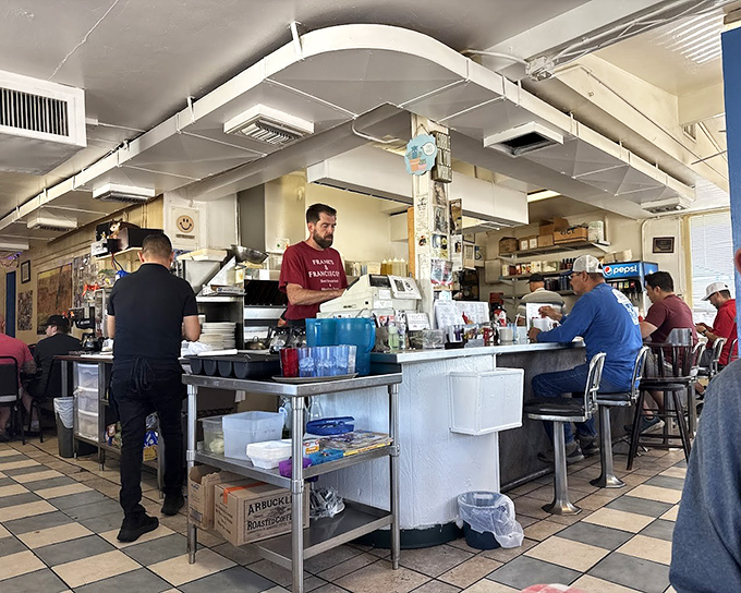 The counter seating offers front-row tickets to the breakfast show, where short-order cooks perform the daily miracle of turning simple ingredients into comfort food masterpieces.