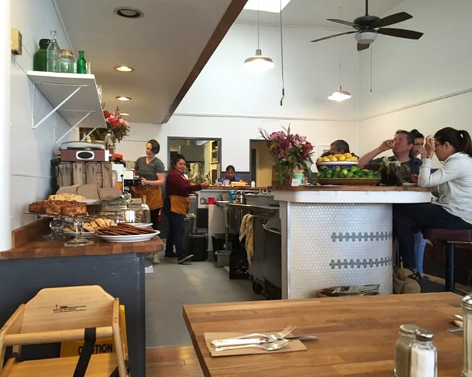 The counter seating offers front-row tickets to the breakfast symphony, where pastries tempt from glass cases and coffee steams with promise.