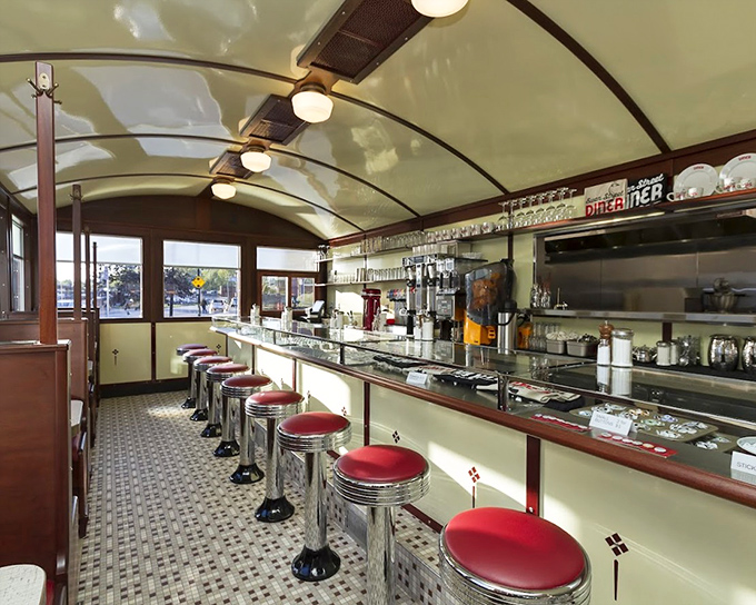 The diner's interior feels like a first-class train car that decided to settle down and serve exceptional food. Those stools aren't just seats&mdash;they're front-row tickets to culinary theater.