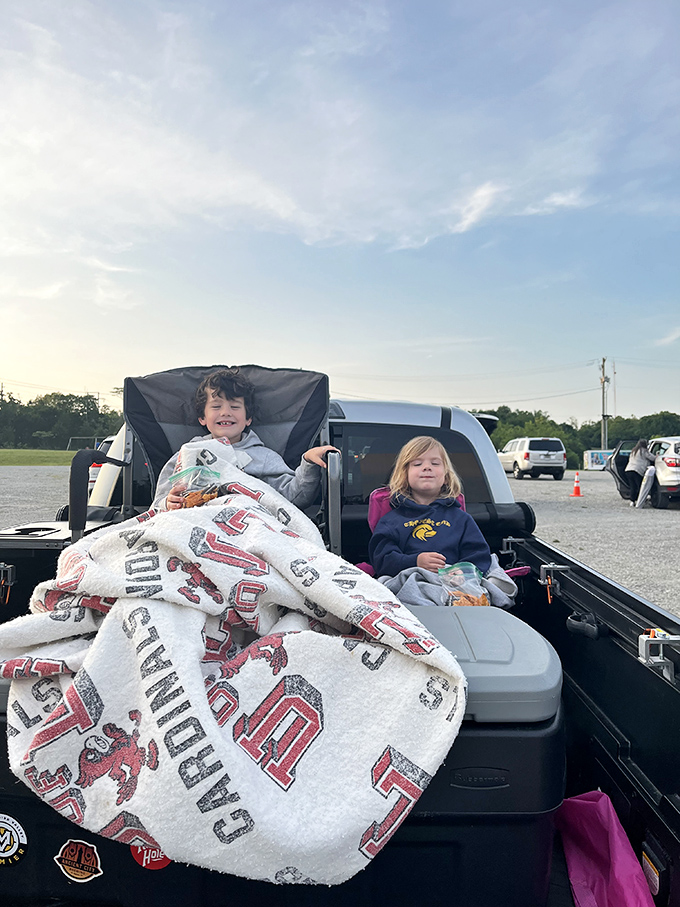 The pickup truck bed becomes the ultimate luxury box, complete with blankets and snacks for the ultimate movie-watching fort.