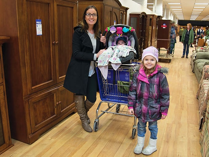 Families discover that furnishing a home doesn't require maxing out credit cards. That smile says "money left for pizza tonight!"