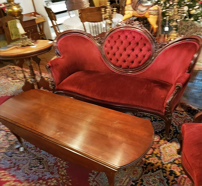 That red velvet settee has witnessed decades of conversations, confessions, and probably a few first kisses. If furniture could talk...