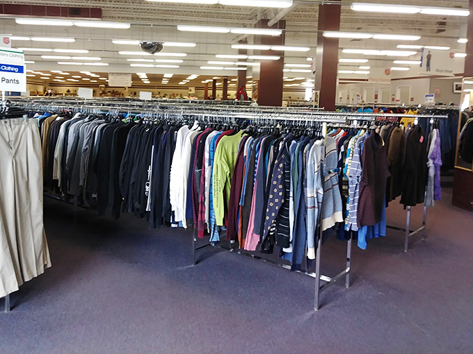 A kaleidoscope of colors and patterns hangs in perfect formation. Your next favorite shirt is hiding somewhere in this textile jungle.