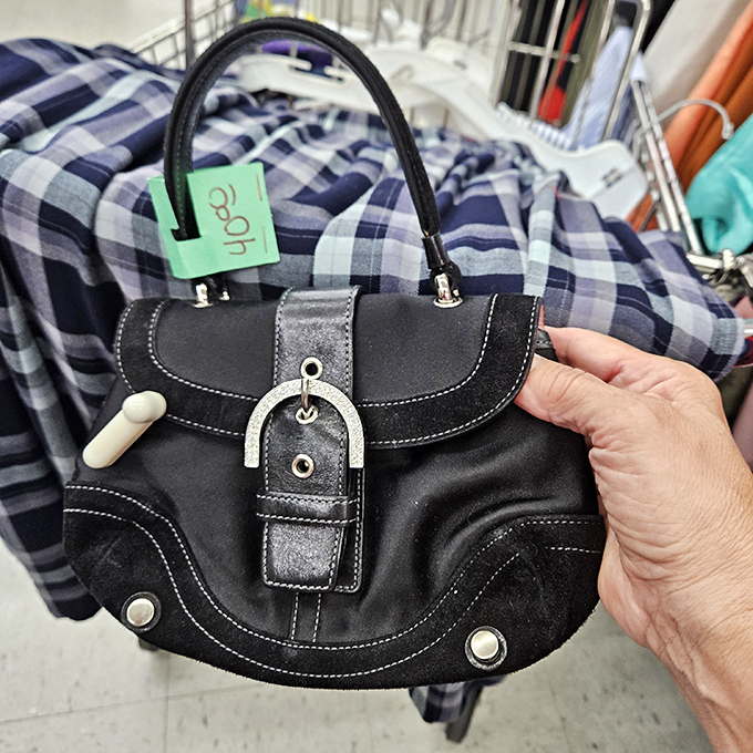 This little black handbag whispers "designer quality" without shouting "I emptied my bank account"&mdash;the ultimate thrift store victory.