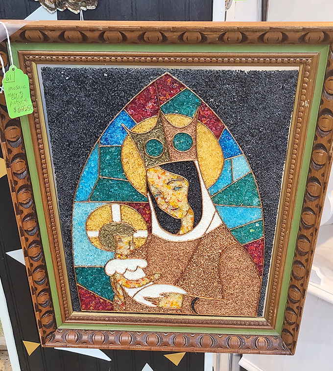 Religious art meets mosaic craftsmanship in this striking piece. Stained glass windows have nothing on this kaleidoscope of colored stones and careful detail.