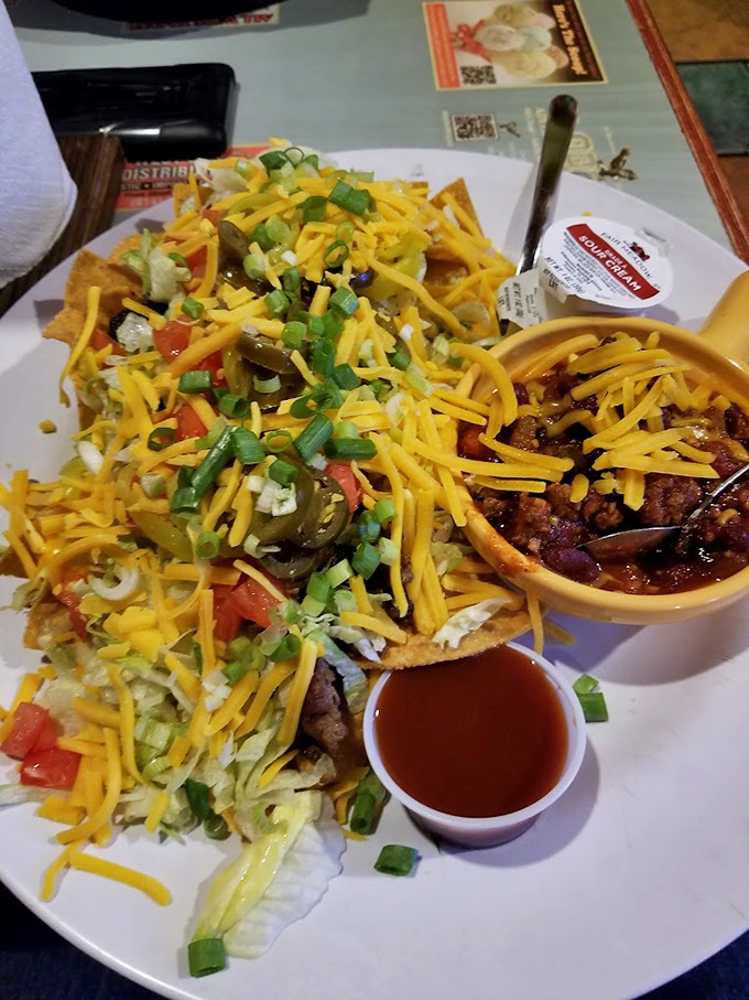 Nachos that require a topographical map to navigate &ndash; a mountain range of cheese, jalape&ntilde;os, and happiness that feeds a family.