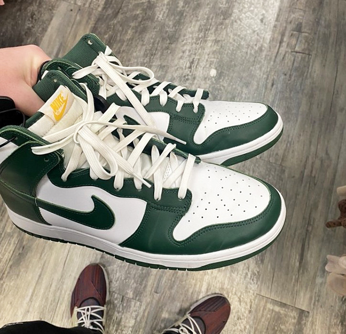 These green and white Nikes aren't just shoes&mdash;they're someone's basketball dreams temporarily on pause, waiting for new courts to conquer.
