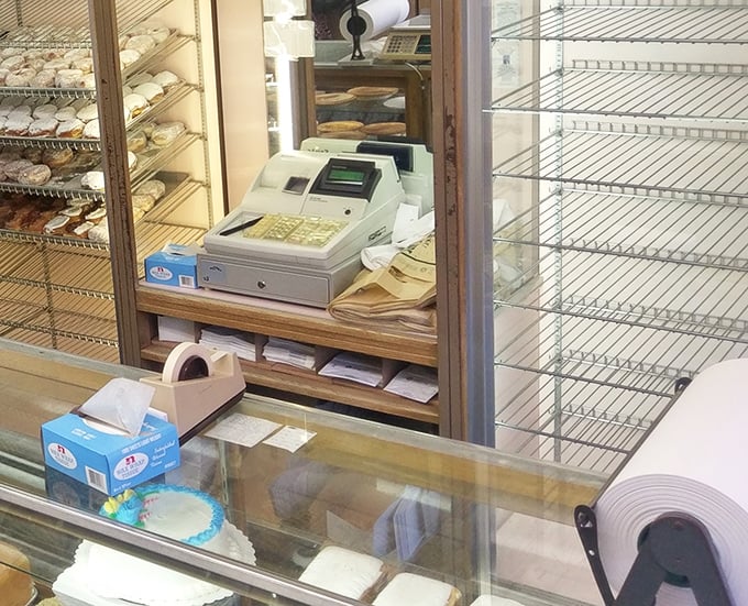 Behind this counter, dreams come true in the form of perfectly wrapped cakes and the sweet smell of tradition.