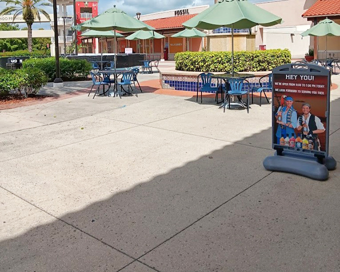 Outdoor seating areas provide strategic resting zones for weary shoppers. The perfect spot to calculate how much you've "saved" so far.