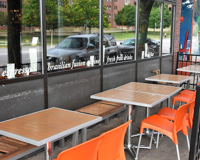 The sidewalk seating area features cheerful orange chairs that seem to say, "Sit here, stay awhile, and watch the world of Ames go by."