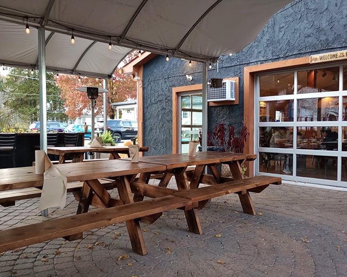 Picnic tables under a tent create that perfect "I discovered this place before it was famous" vibe that makes the food taste even better.