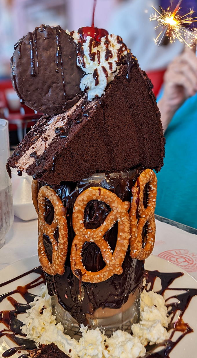 This isn't just dessert, it's an architectural marvel of chocolate, pretzels and whipped cream that demands to be photographed before demolished.