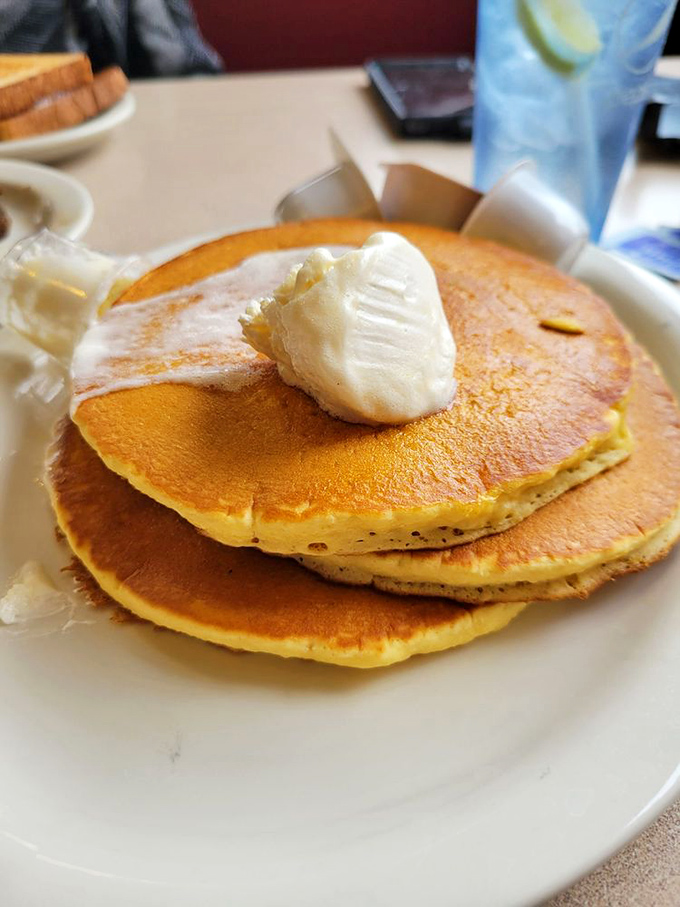 These pancakes aren't just breakfast &ndash; they're fluffy golden discs of joy topped with a melting butter crown.