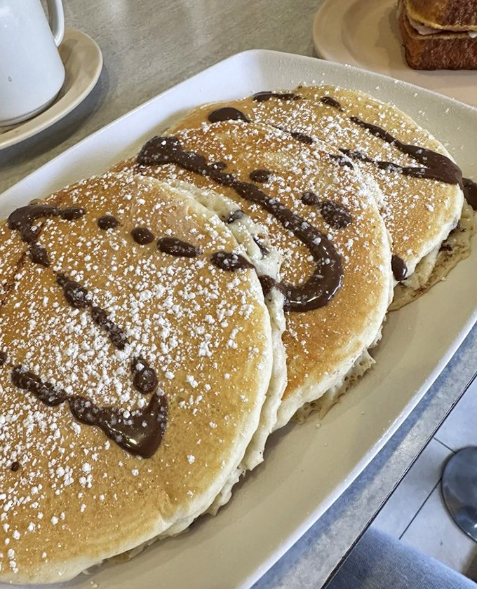 Pancakes that look like they were painted by a Renaissance master&mdash;golden, fluffy, and adorned with chocolate and powdered sugar. Breakfast or dessert? Yes.